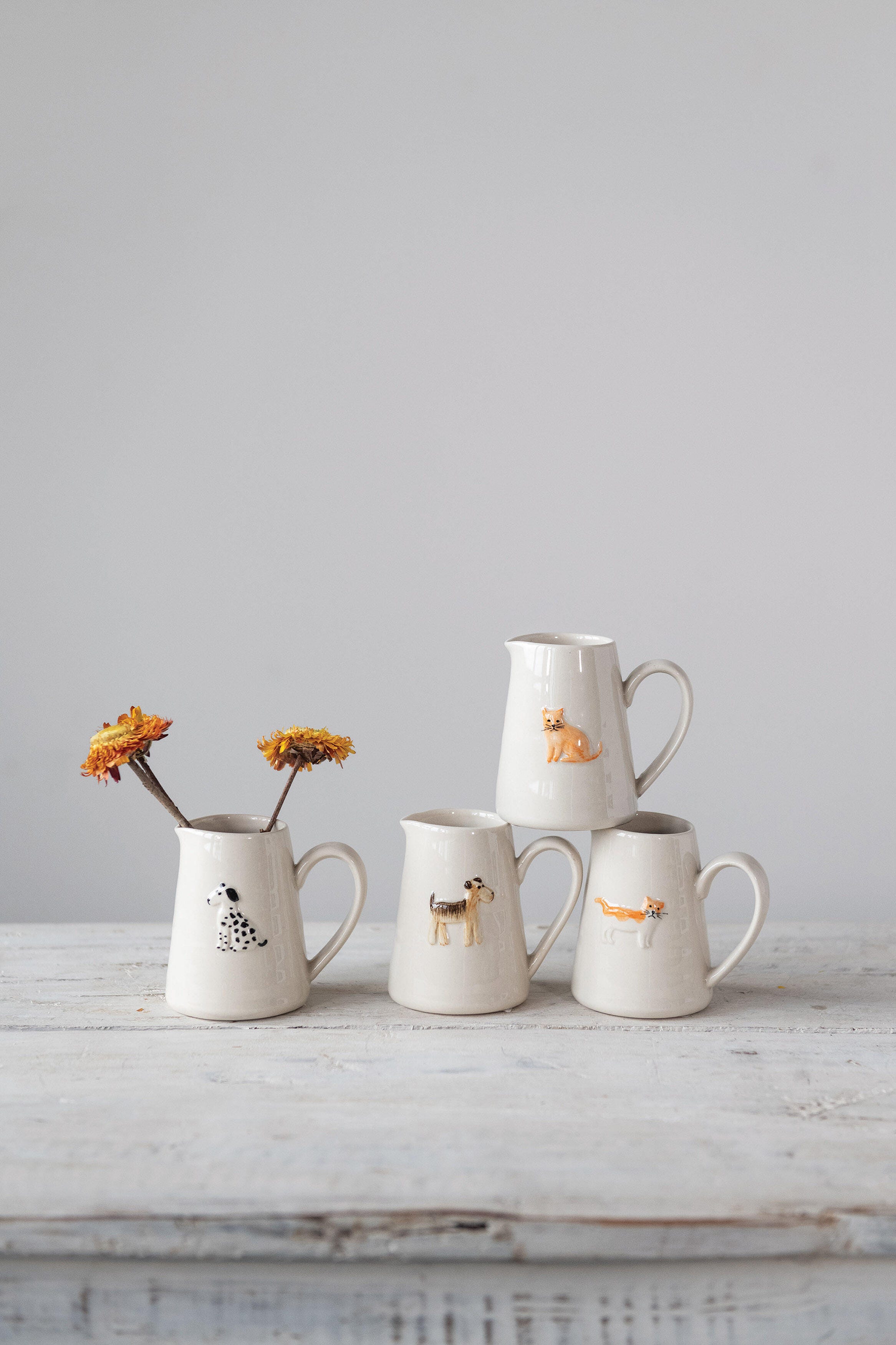 Click here for Storied Home Embossed Cat and Dog Design Pitchers... prices