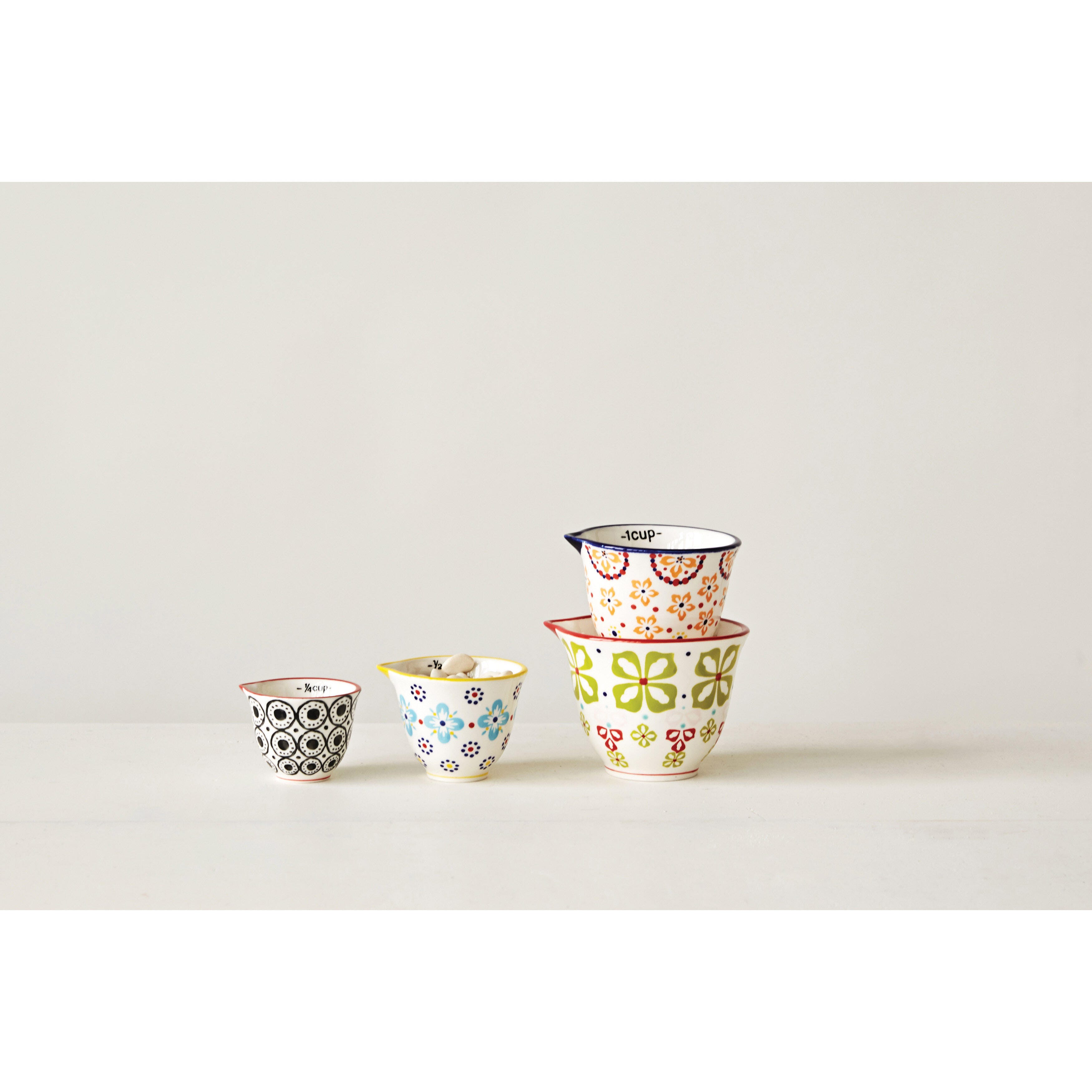 Click here for Storied Home Floral Stamped Measuring Cups (Set of... prices