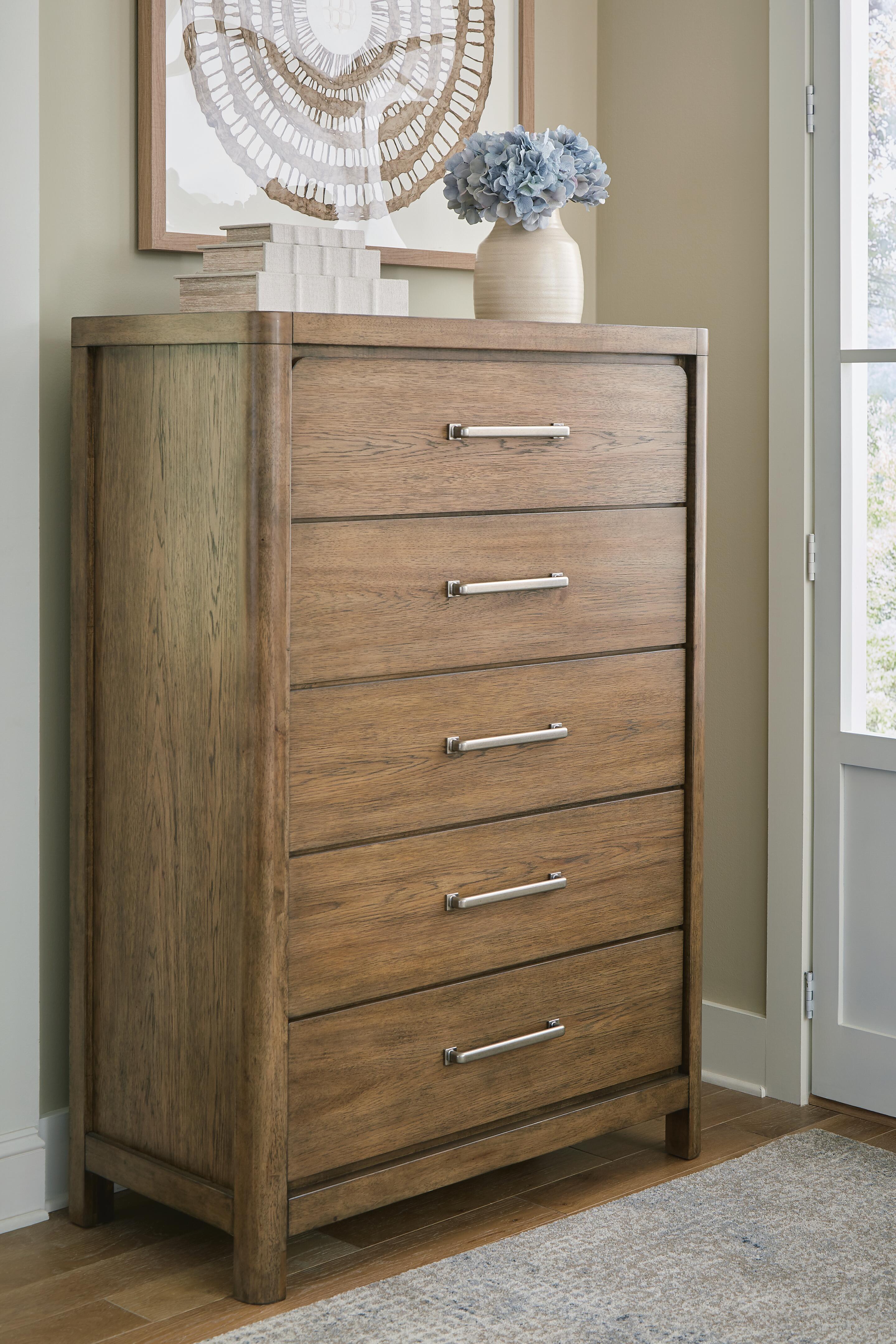 Click here for Cabalynn 5 Drawer Chest  Light Brown prices