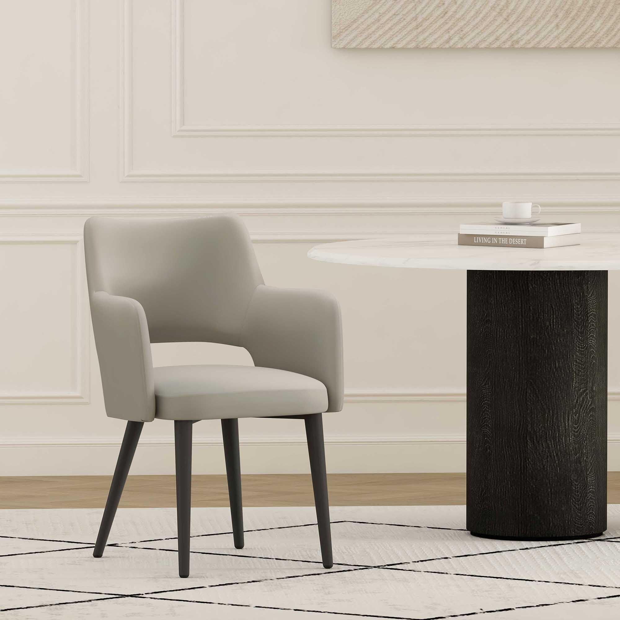 Click here for Manhattan Comfort Tremont Dining Arm Chair  Stone prices