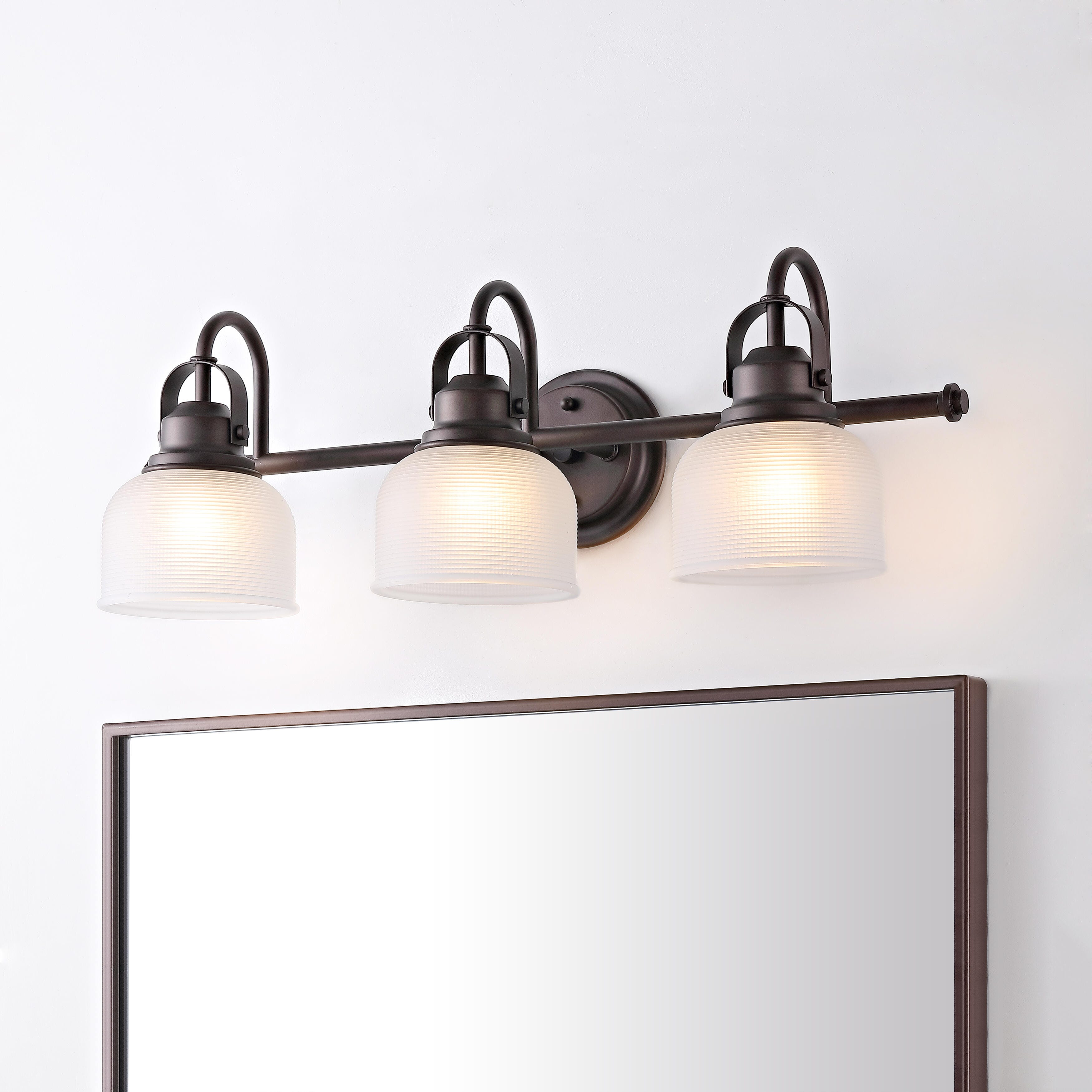Click here for Jonathan Y 3-Light Sconce  Rubbed Bronze prices