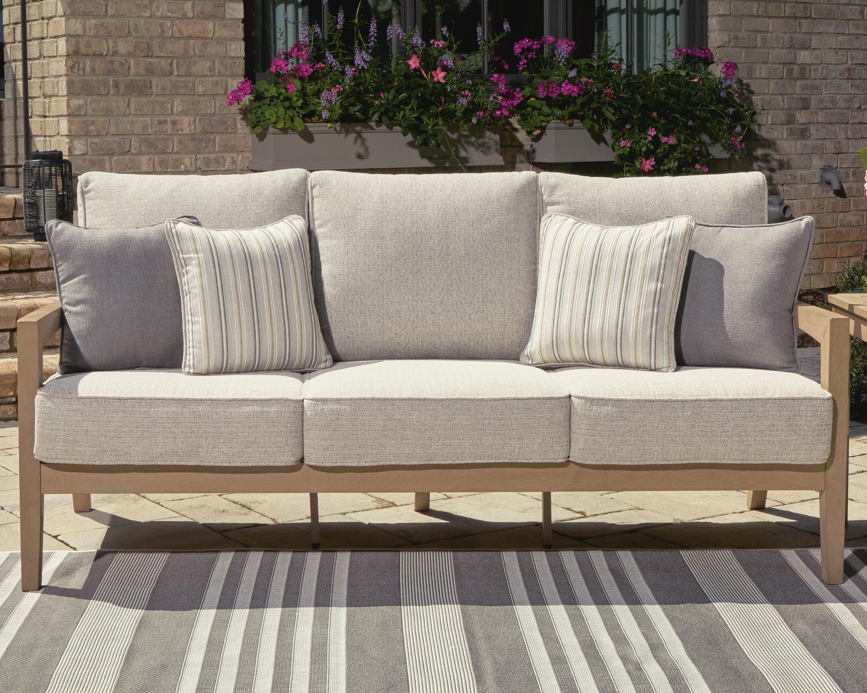 Click here for Hallow Creek Outdoor Sofa with Cushion  Driftwood prices