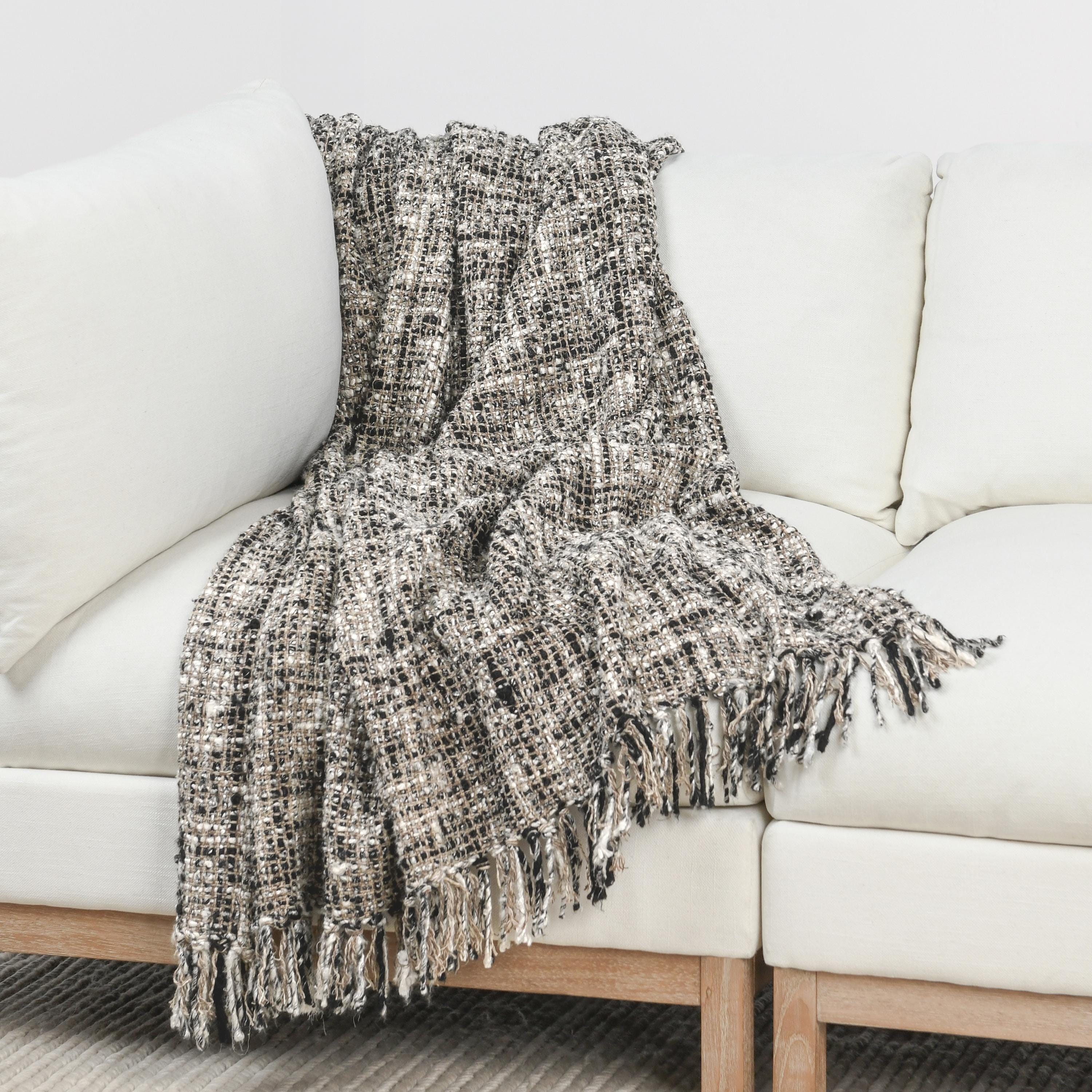 Click here for Ashley Luxe Tassel Throw Blanket  Black prices