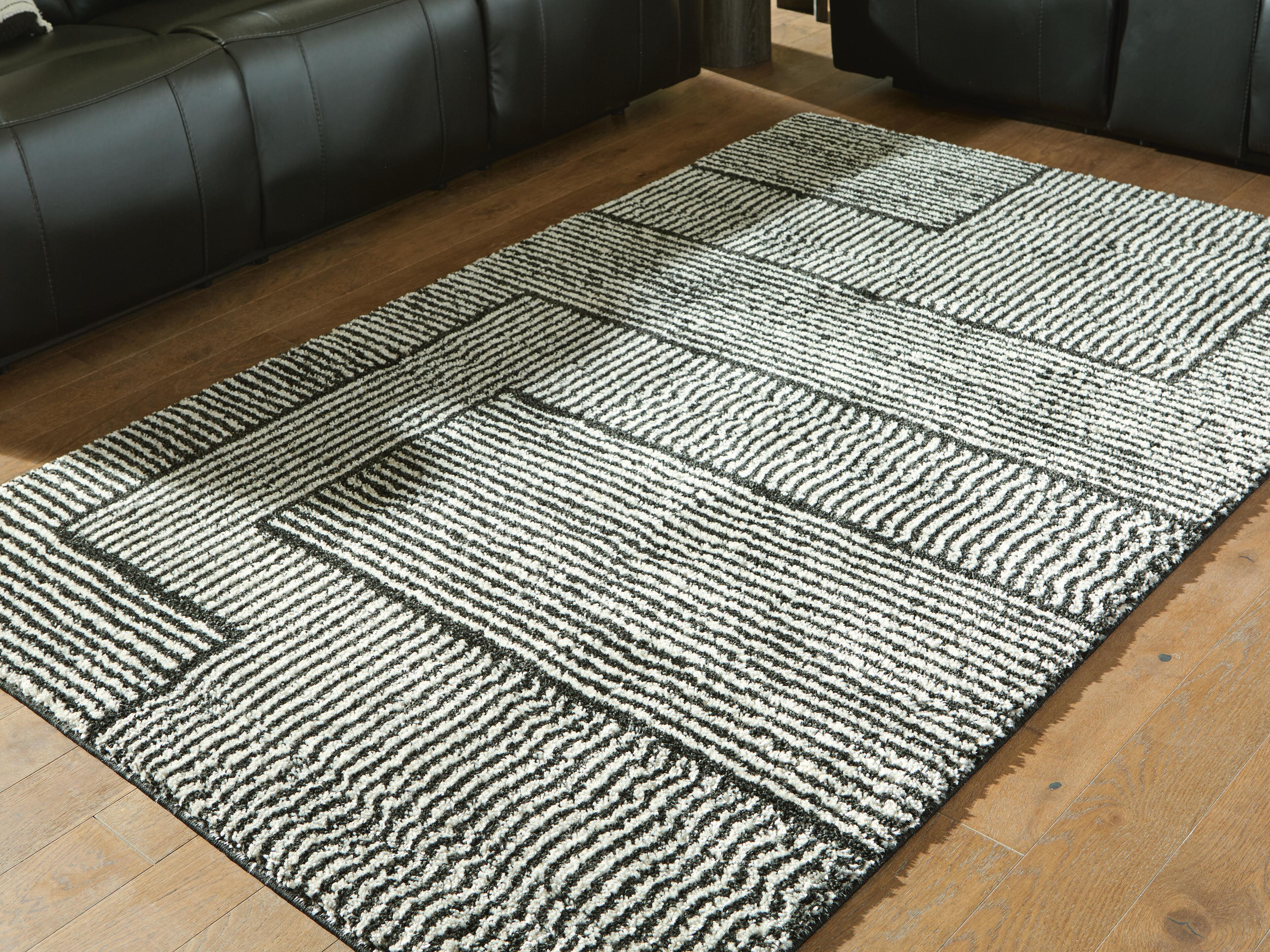 Click here for Kurtmen 5 x 7 Area Rug  Black/Ivory prices