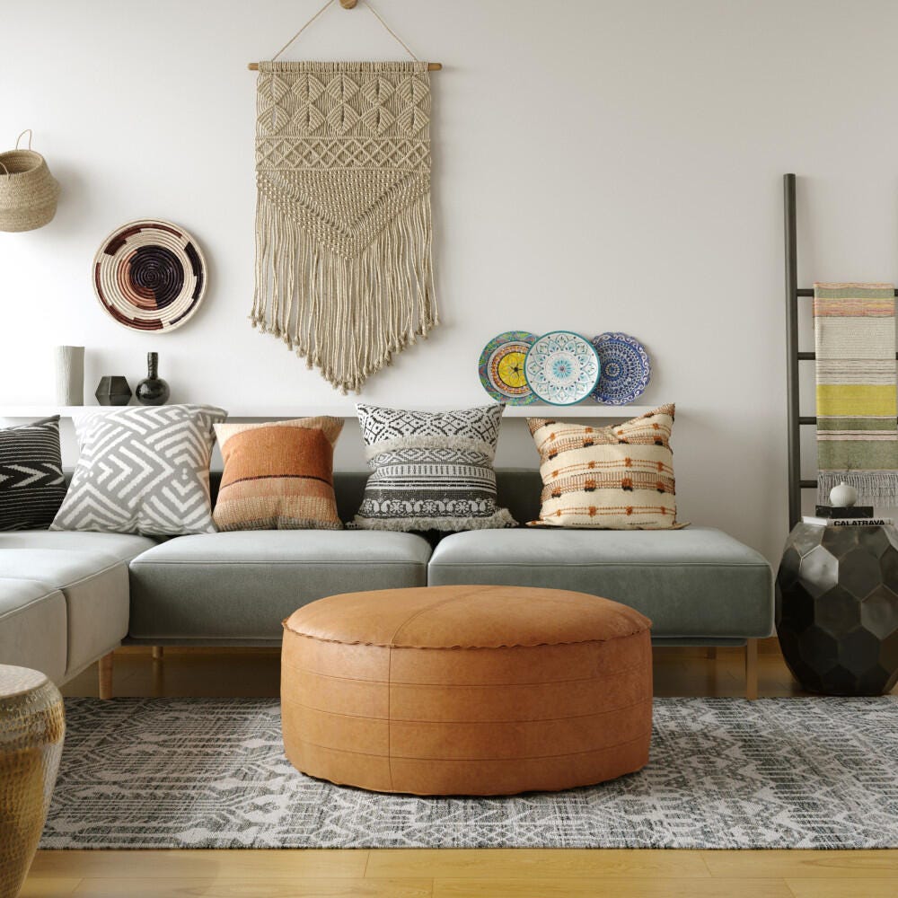 Click here for Simpli Home Brody Round Ottoman in Distressed Faux... prices