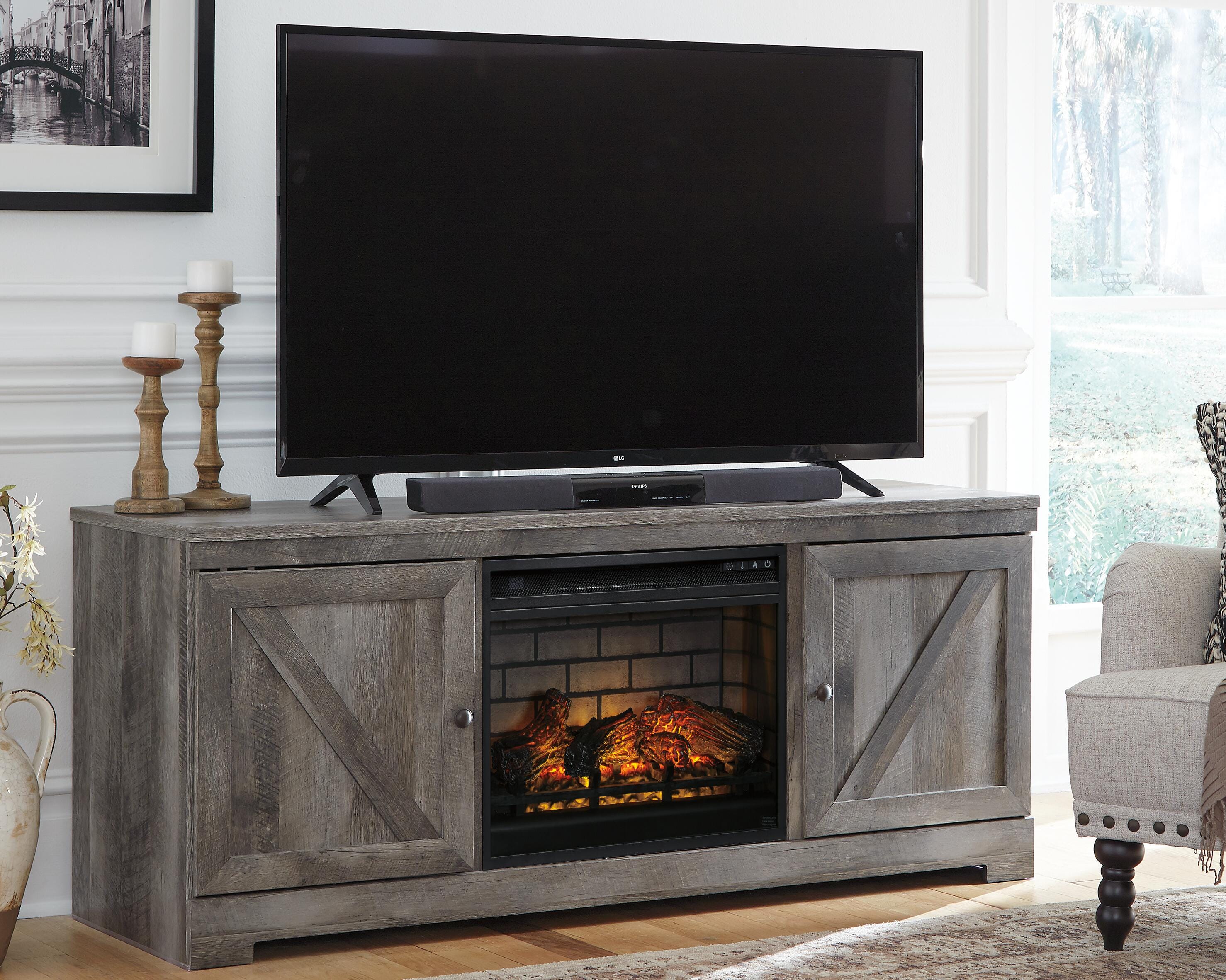 Click here for Wynnlow 63 TV Stand with Electric Fireplace for La... prices